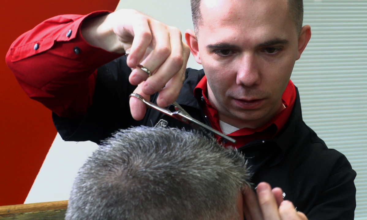 Justin Mangum, owner of Justin’s Barber Shoppe, 3791 B Opelika Road in ...