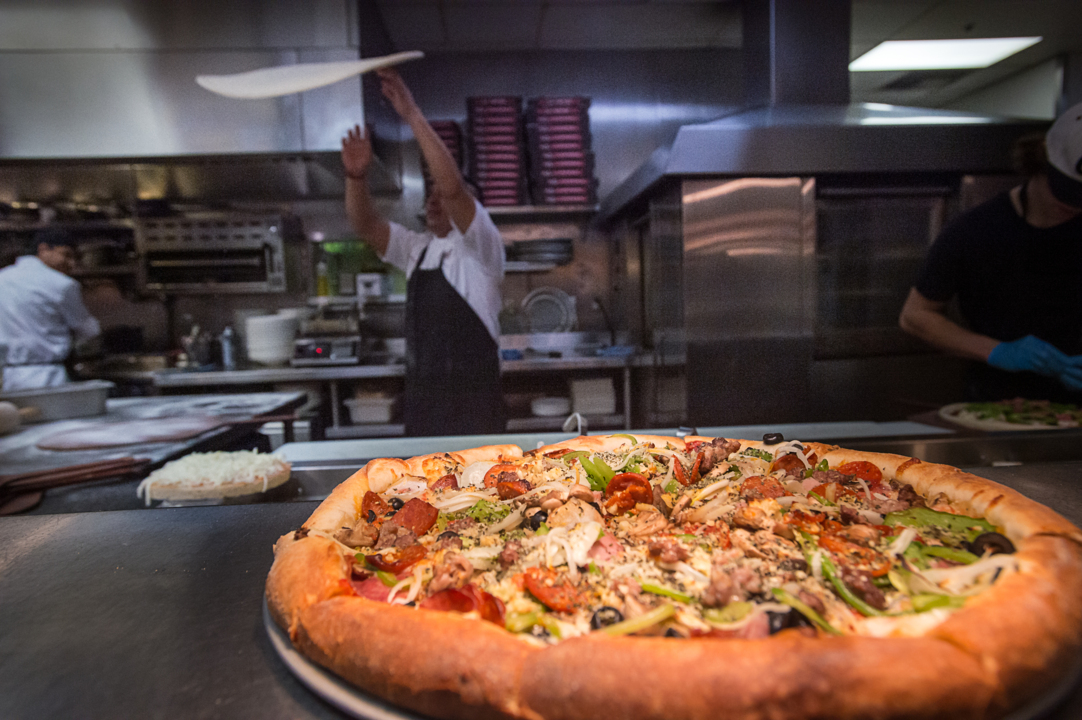 Pregnant women eat a Prego pizza from Skipolini Pizza to help induce ...