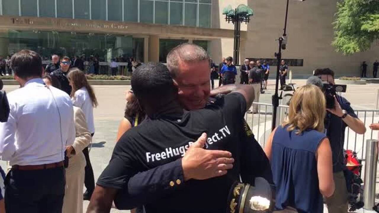 Officers get 'free hugs' as they leave Dallas police memorial | Fort ...
