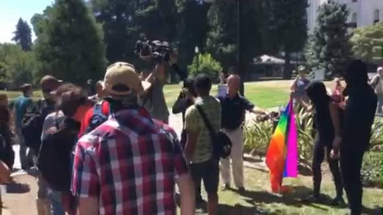 Anti-fascist protesters confront TV crew at California Capitol | Fresno Bee