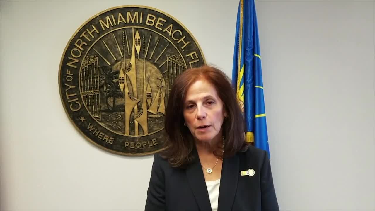 North Miami Beach Mayor Beth Spiegel delivers a message to residents of ...
