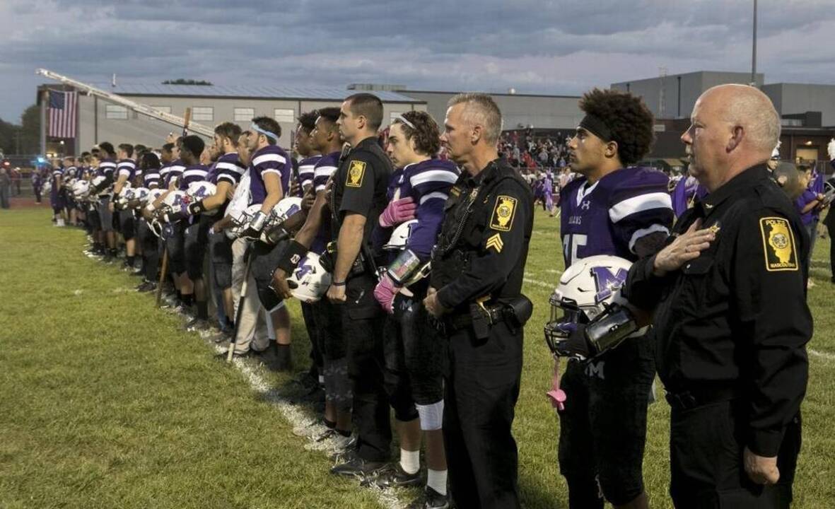 Mascoutah IL football team, police stand for national anthem ...