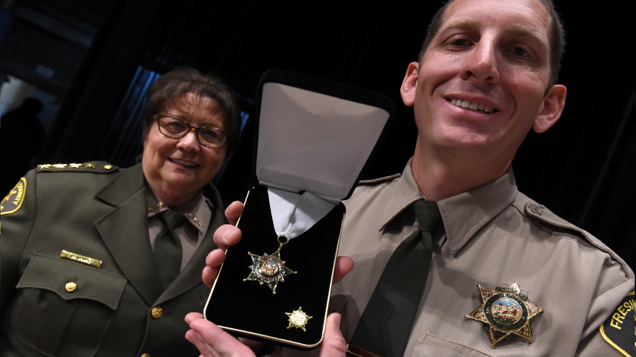 Fresno County Sheriff's Sgt. David Rippe receives the department’s Life ...