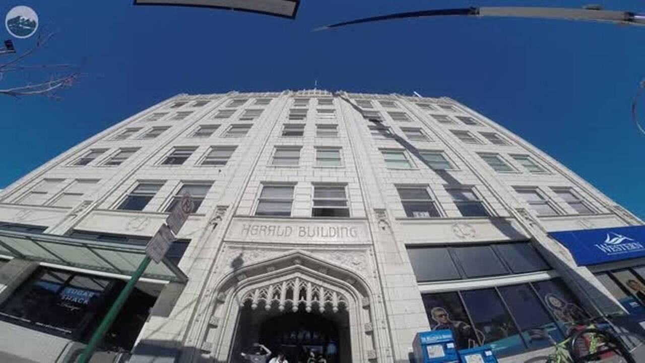 Watch as new letters are lifted into place for the sign atop the Herald ...