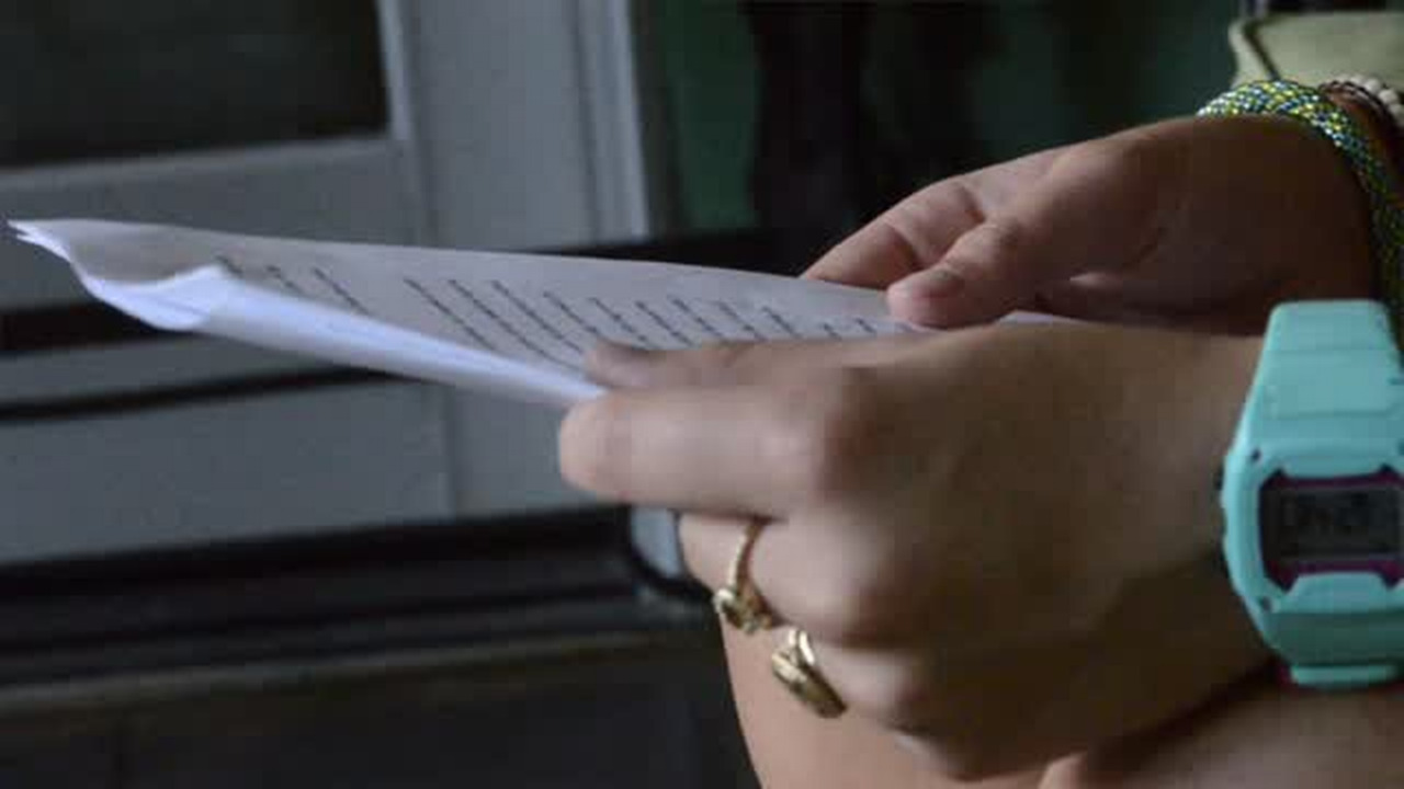 Sarah Carlton reads a portion of her speech | Charlotte Observer