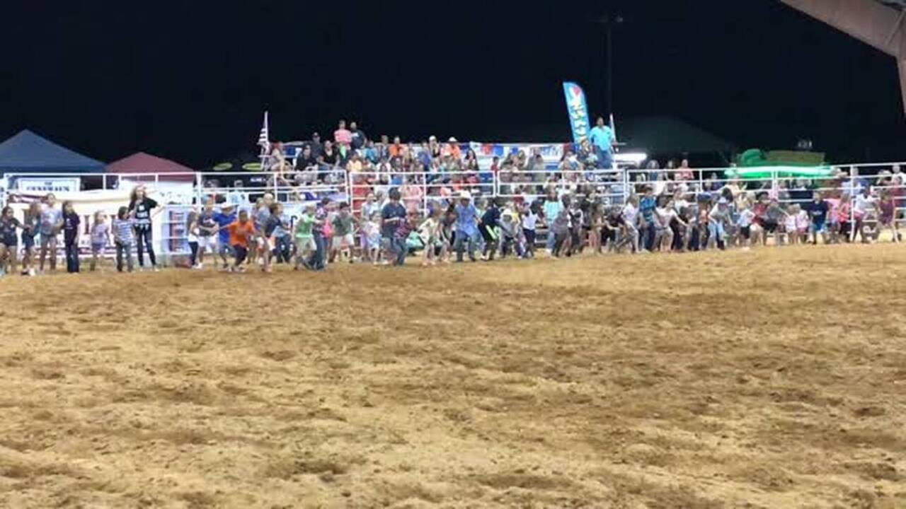 Kids participate in a "boot scramble" at the South Congaree Rodeo ...