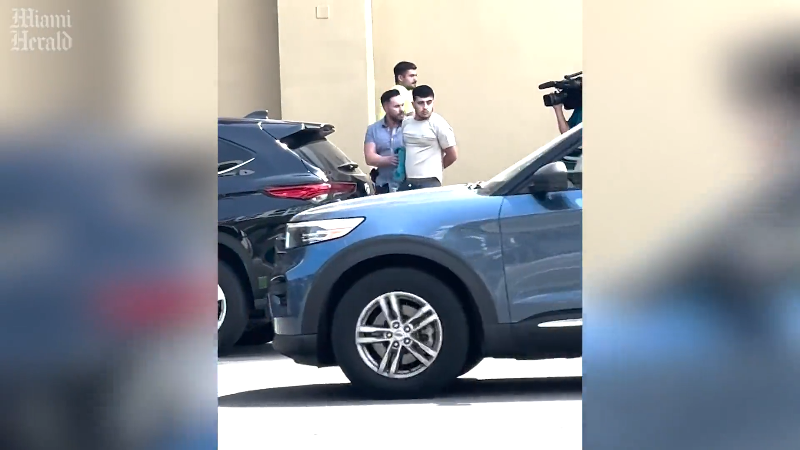 WATCH: Video shows officers taking away man in handcuffs accused of ...